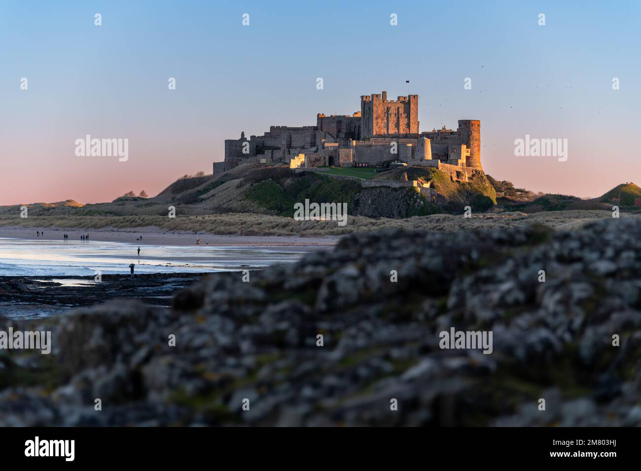 Bamburgh beach at sunset, UK Stock Photo - Alamy