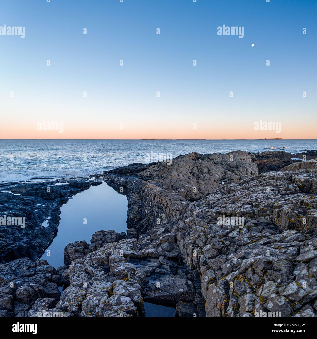 Bamburgh beach at sunset, UK Stock Photo - Alamy