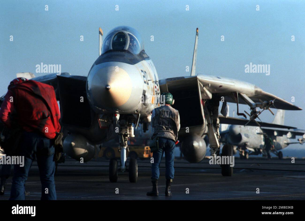 A Fighter Squadron 142 (VF-142) F-14A Tomcat aircraft is positioned on ...