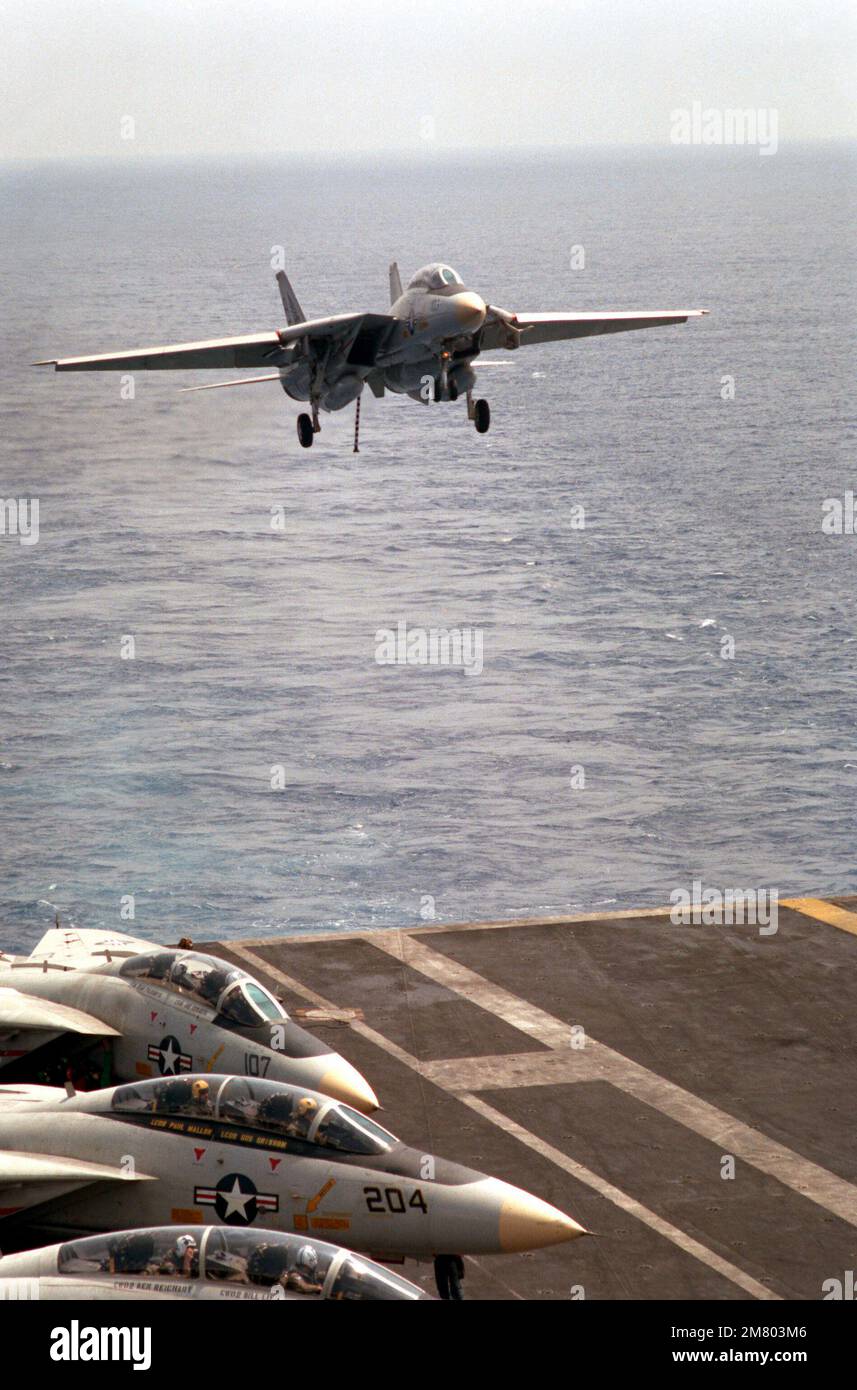 A Fighter Squadron 143 (VF-143) F-14A Tomcat aircraft comes in for a ...