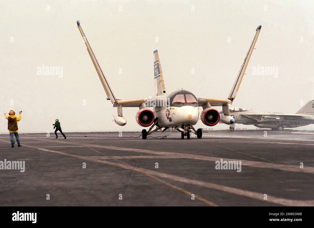 An Air Anti-submarine Squadron 31 9VS-31) S-3A Viking aircraft folds ...