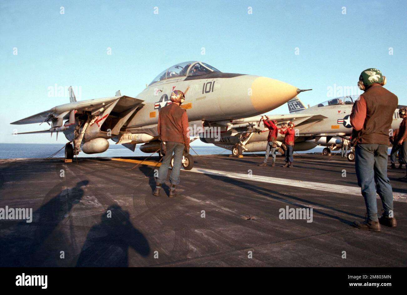 A Fighter Squadron 143 (VF-143) F-14A Tomcat aircraft is readied for ...