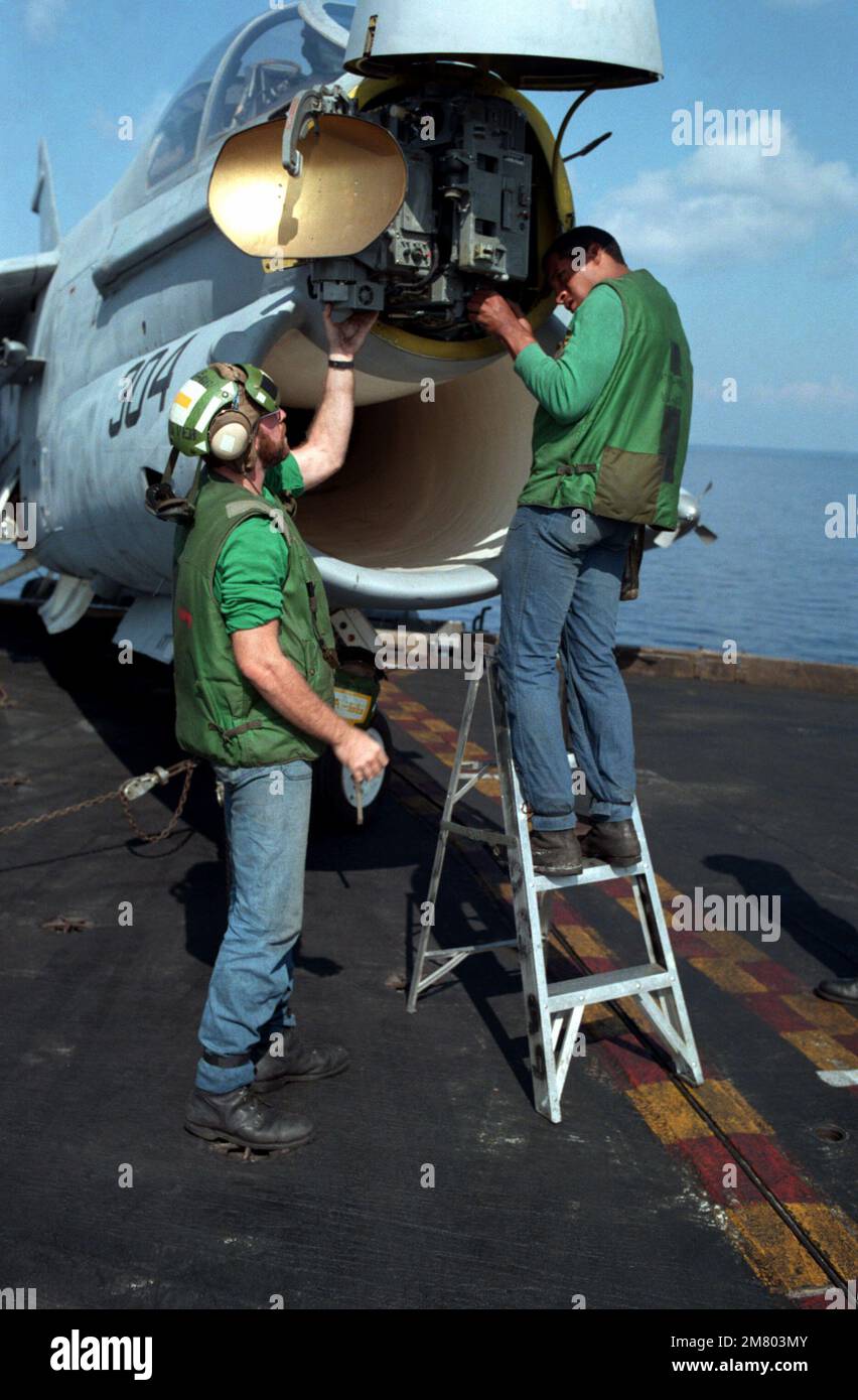 Maintenance crew members of Attack Squadron 66 (VA-66) service the APQ ...