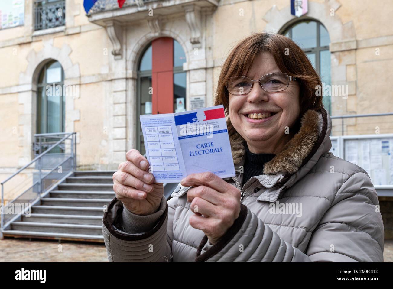 RESIDENT WHO HAS GONE TO VOTE WITH HER VOTER'S CARD IN HER HAND, CARE ...
