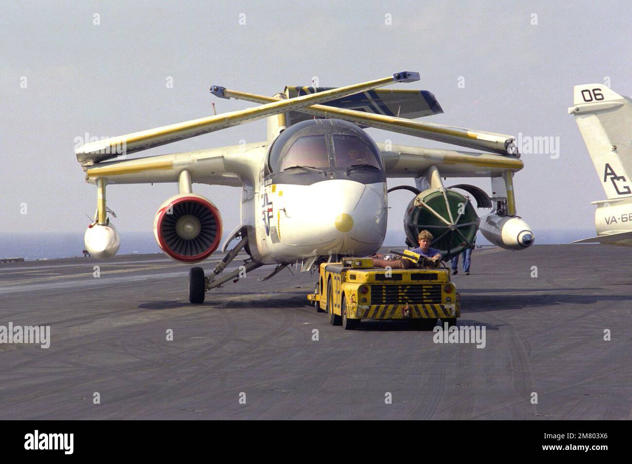 An MD-3A tow tractor pulls an Air Anti-submarine Squadron 31 (VS-31) S ...
