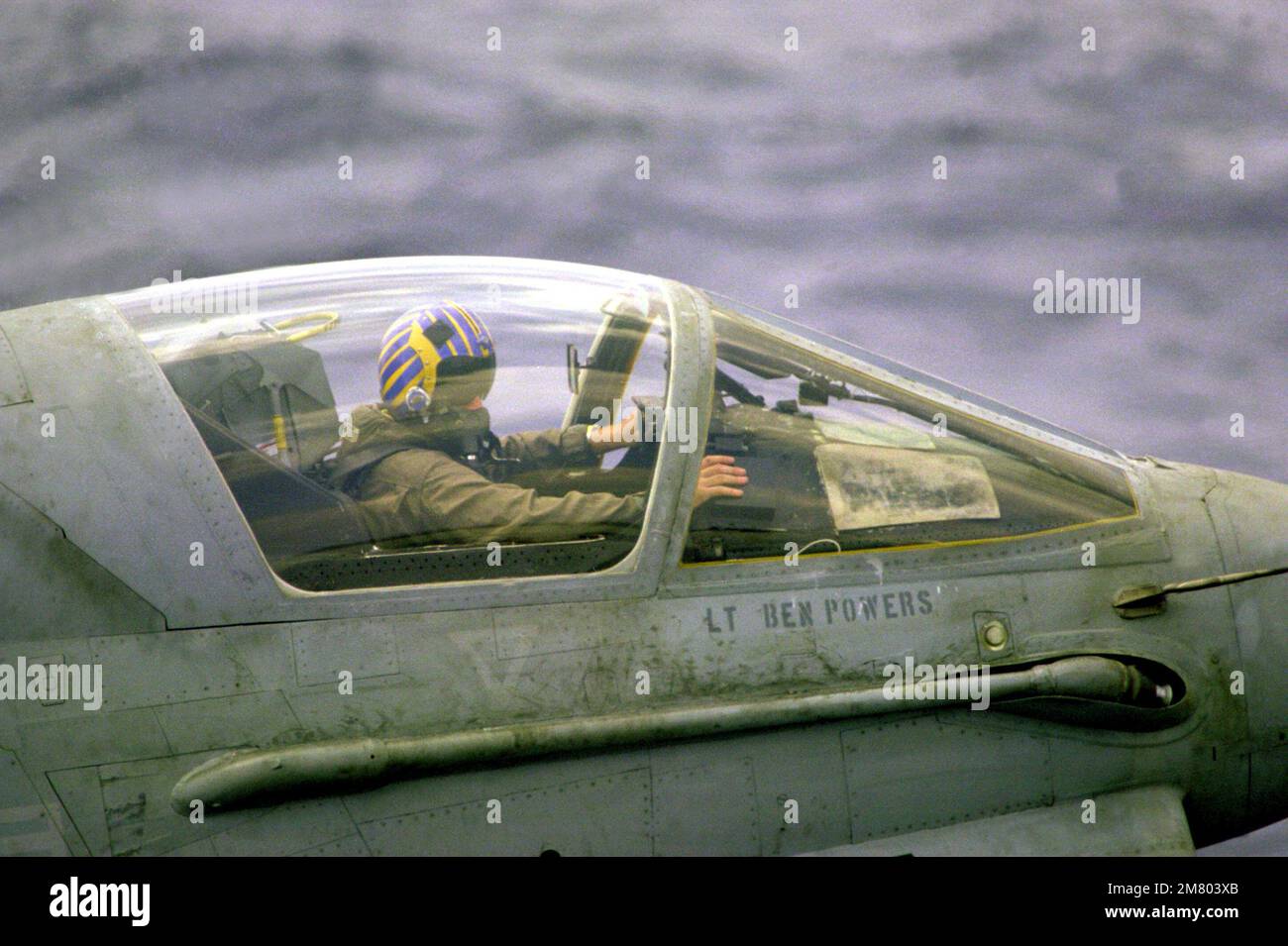 LT. Ben. Powers prepares for a late evening launch in the cockpit of ...