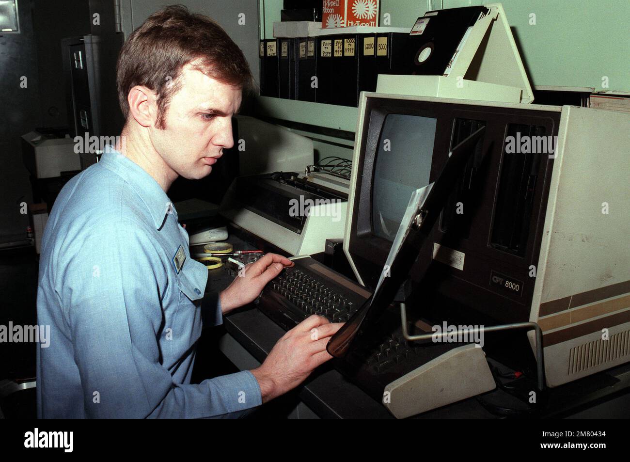 Intelligence SPECIALIST SEAMAN L. Sieracki operates a computer terminal ...