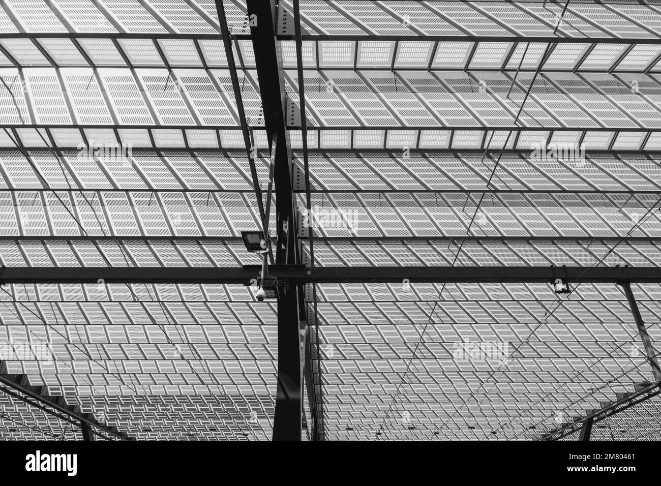 Black and white detail of grid steel fold ceiling and roof with long ...