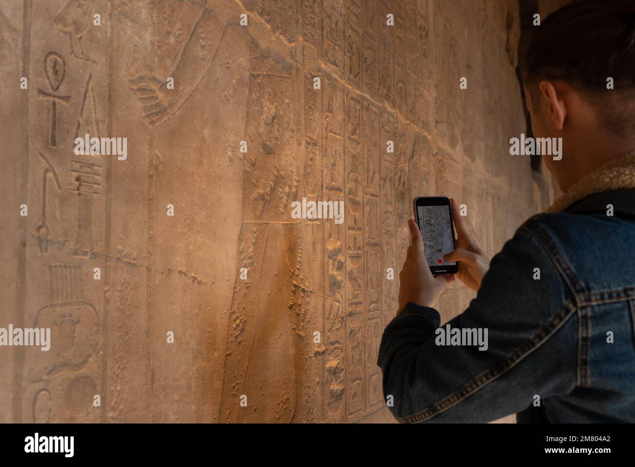 Close up view of young man recording a video for social media to the ...