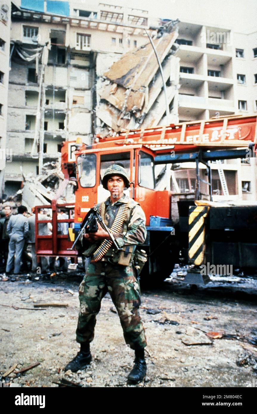 Two Marines stand in front of the U.S. Embassy which was destroyed by a terrorist bomb attack ...