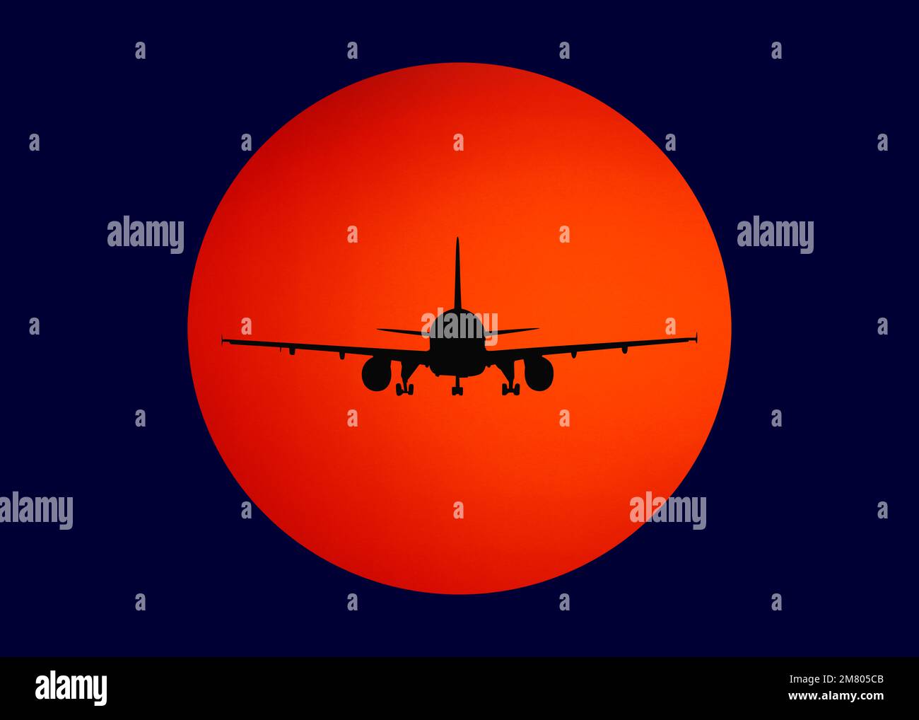 black silhouette of the plane against the orange sun in the blue sky ...