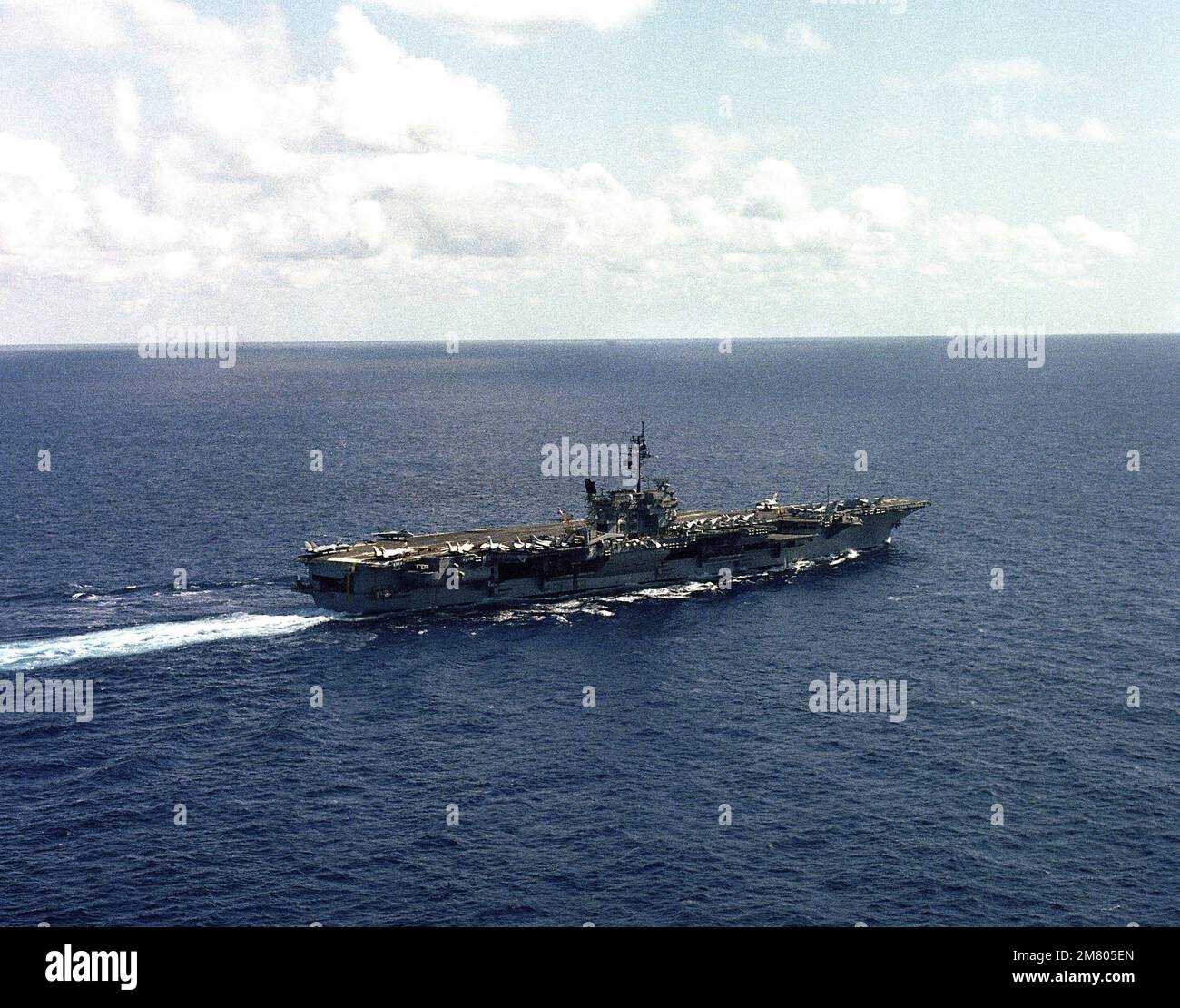 An aerial starboard quarter view of the aircraft carrier USS KITTY HAWK ...