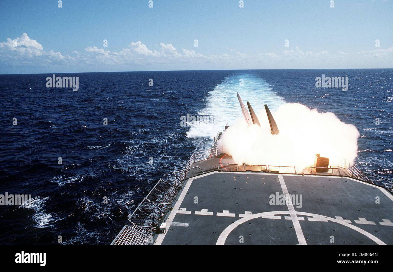 A view of a missile being fired from the aft launcher aboard the guided ...