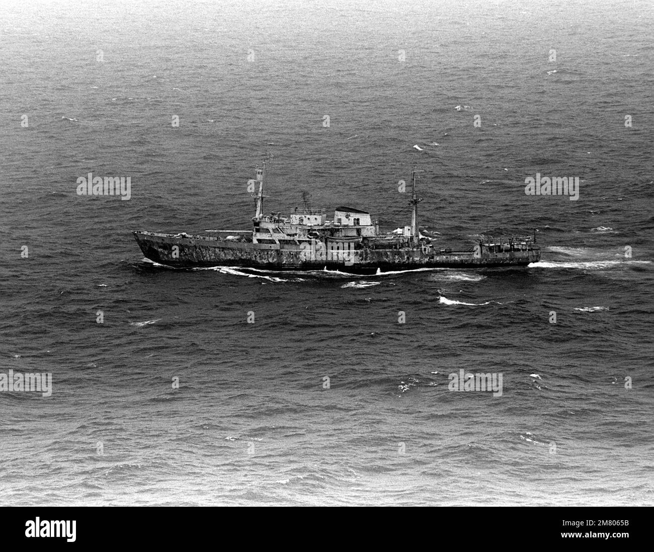 An aerial port beam view of a Soviet intelligence collector ship (AGI ...