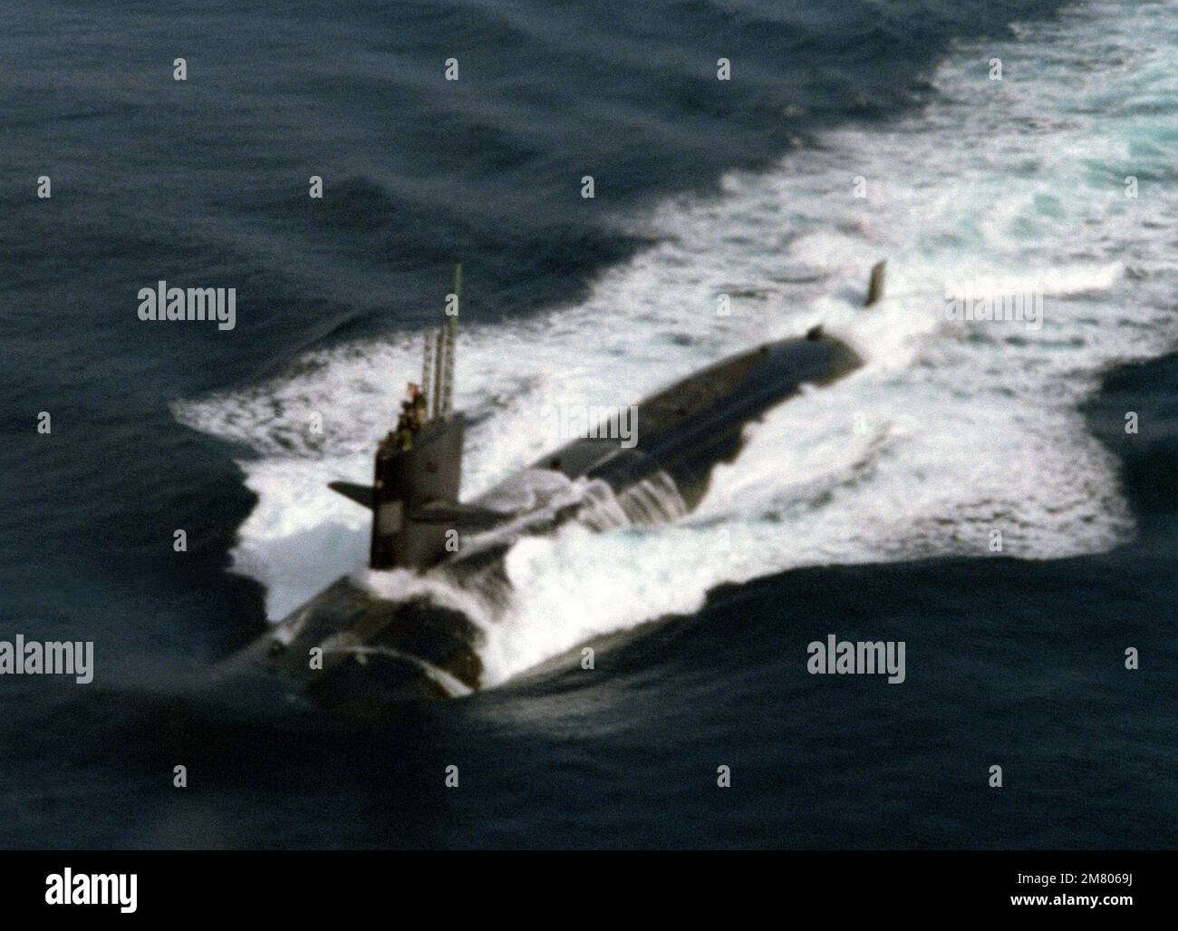 An aerial port bow view of a Sturgeon class nuclear-powered attack ...