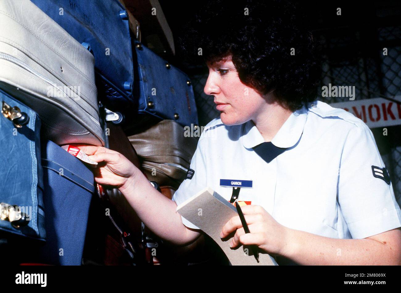 AIRMAN 1ST Class Leslie Gannon, 316th Aerial Port Squadron, looks for ...