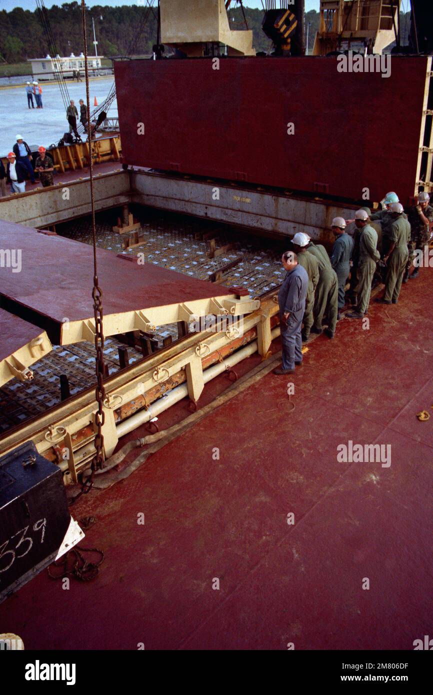 The cargo hold of a ship is opened for the offloading of ammunition ...