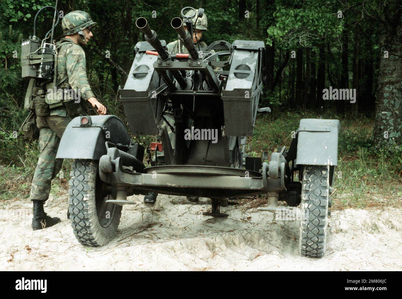 Members of the 3rd Battalion, 2nd Marine Division, examine a Soviet ZPU ...
