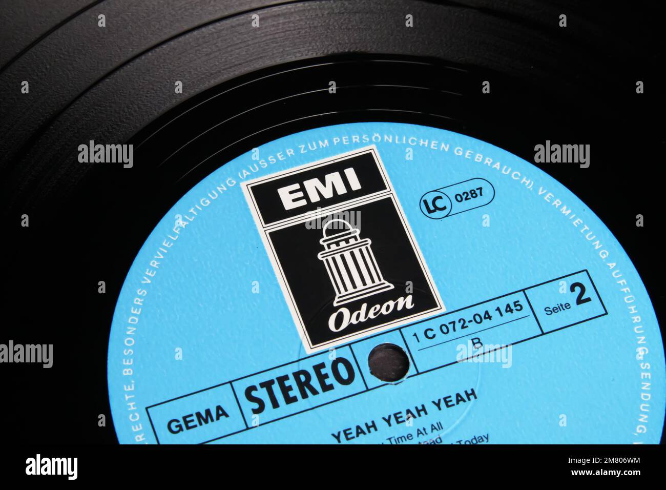 Viersen, Germany - November 9. 2022: Closeup of isolated vinyl record with logo of british EMI ...