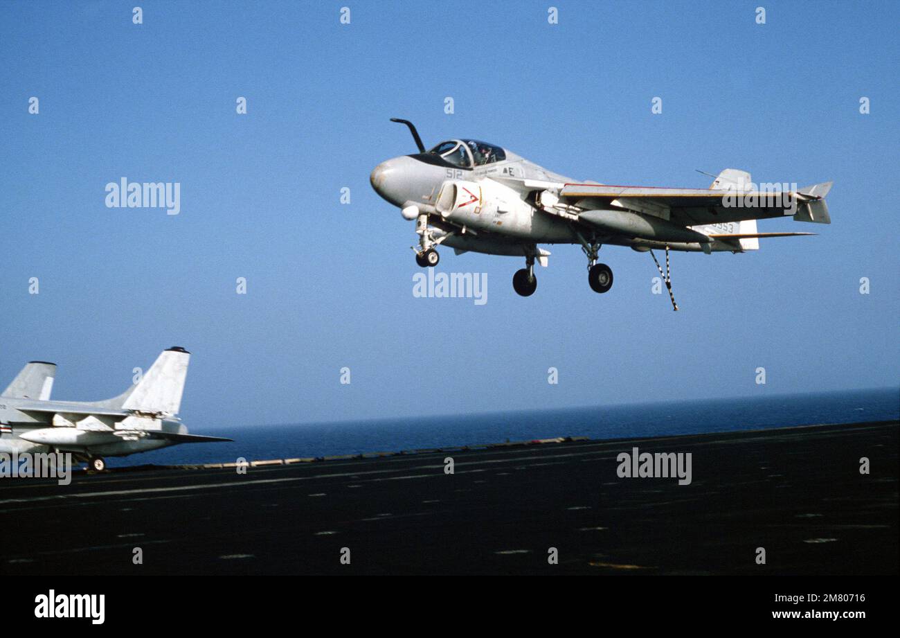 Right front view of an A-6 Intruder aircraft landing on the flight deck ...