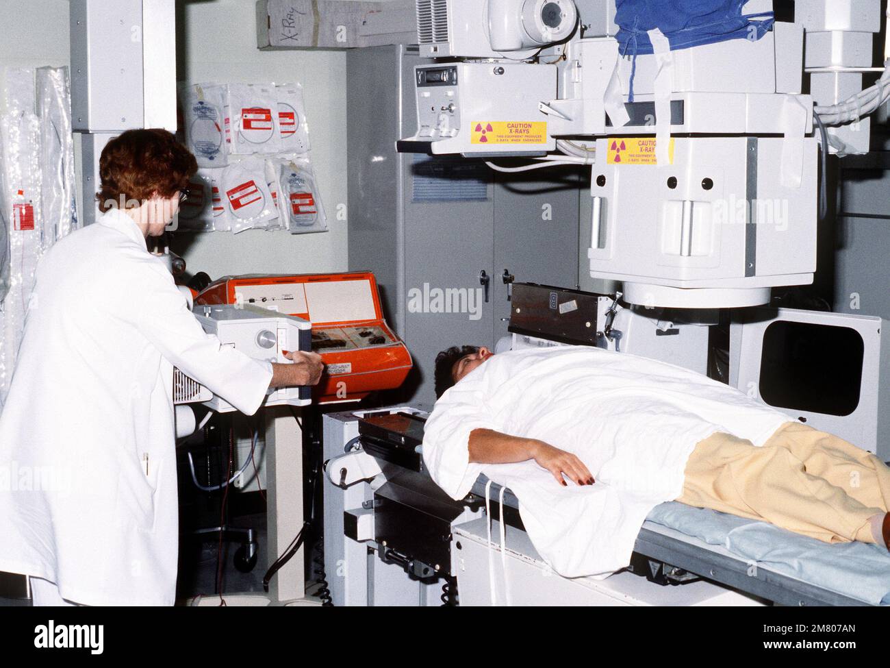 An X-ray technician performs an X-ray on a patient at Gorgas Army ...