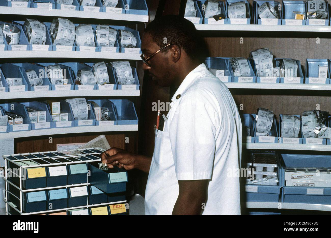 SPECIALIST Fourth Class Lewis, a pharmacy technician, replaces medicine ...