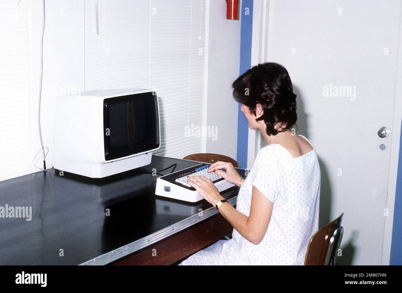 A technician enters data into a data processing machine at Gorgas Army ...