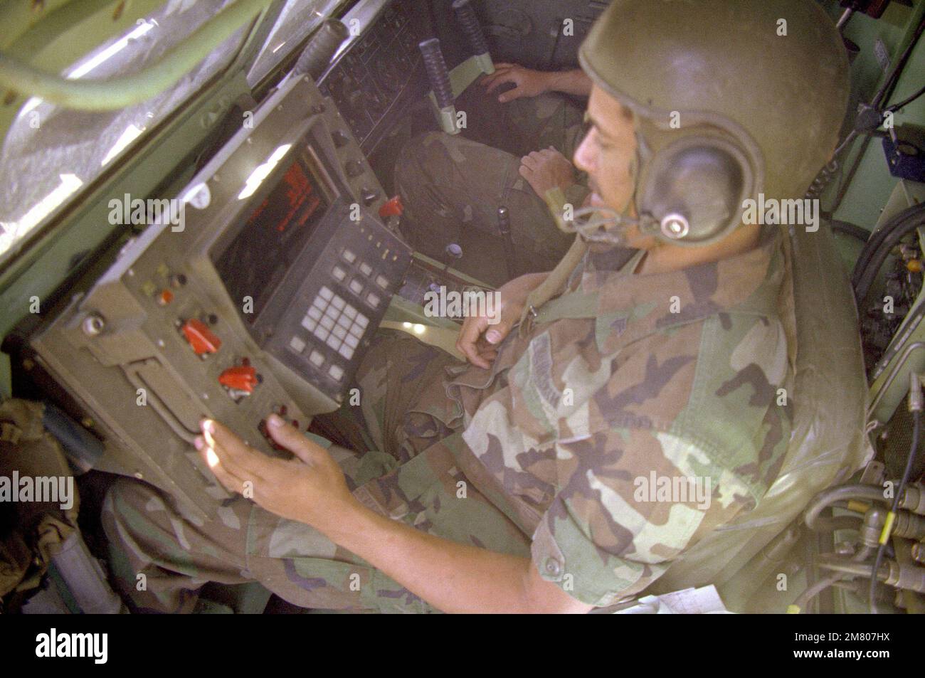A member of the 3rd Bn., 6th Field Arty., 1ST Infantry Div., operates a ...