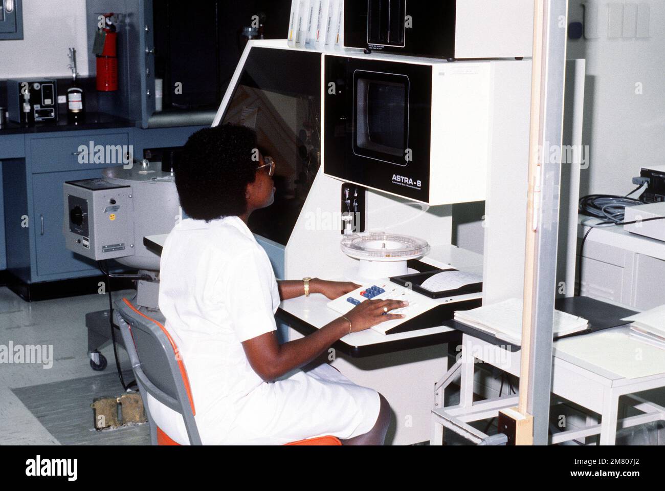 A technician enters data into a computer at Gorgas Army Hospital. Base ...