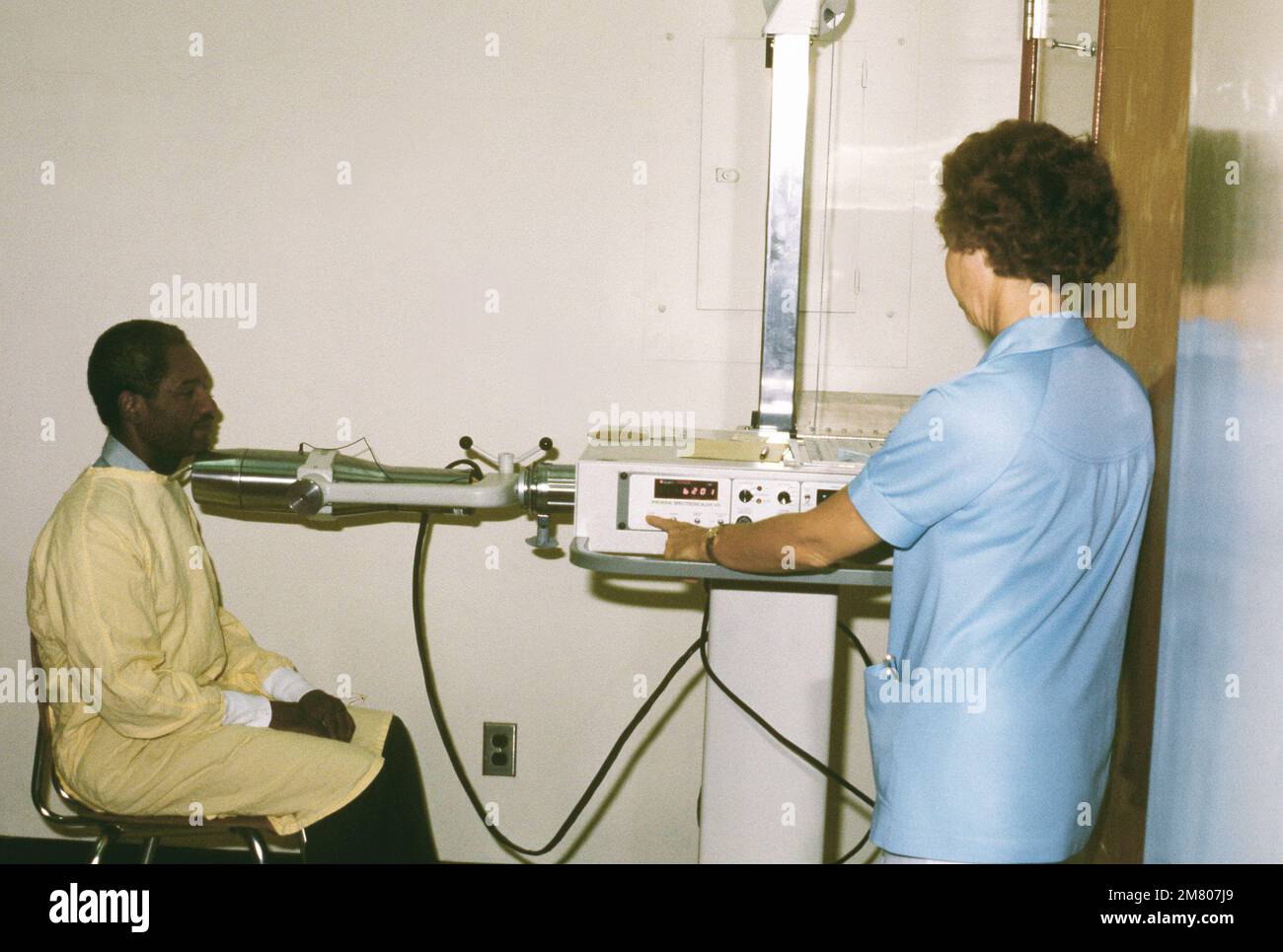 A technician gives radioisotope treatment to a patient at Gorgas Army ...