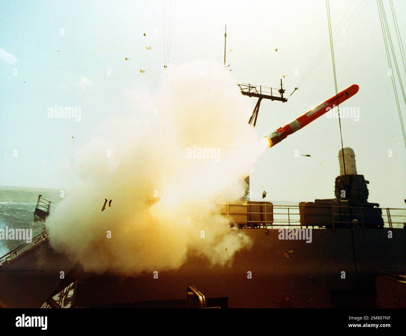 A view of a Tomahawk missile being launched from one of the eight ...