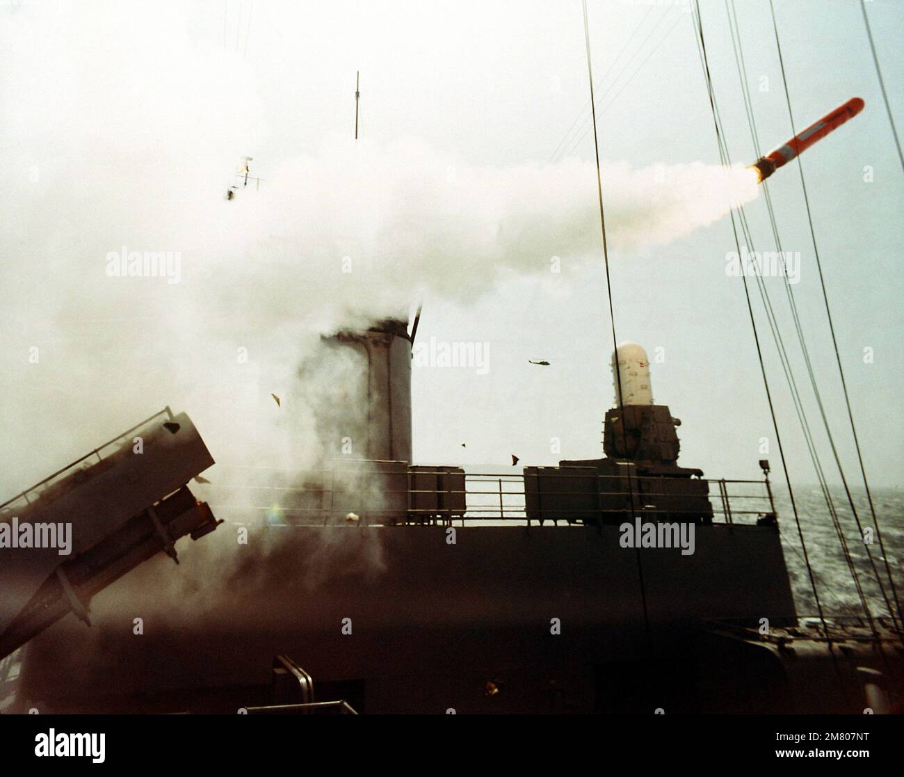 A view of a Tomahawk missile being launched from one of the eight ...