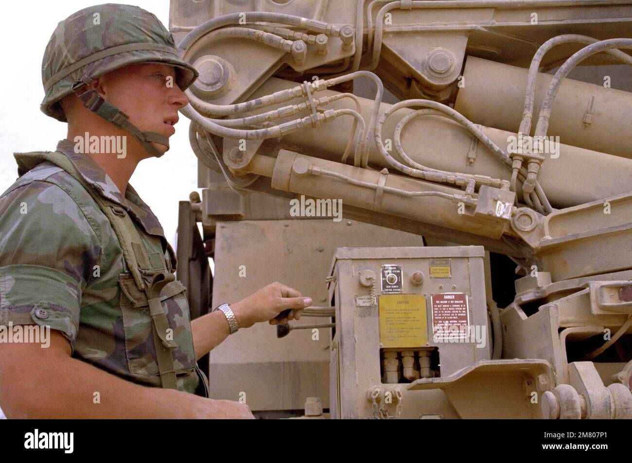A member of the 3rd Bn., 6th Field Arty., 1ST Infantry Div., operates a ...