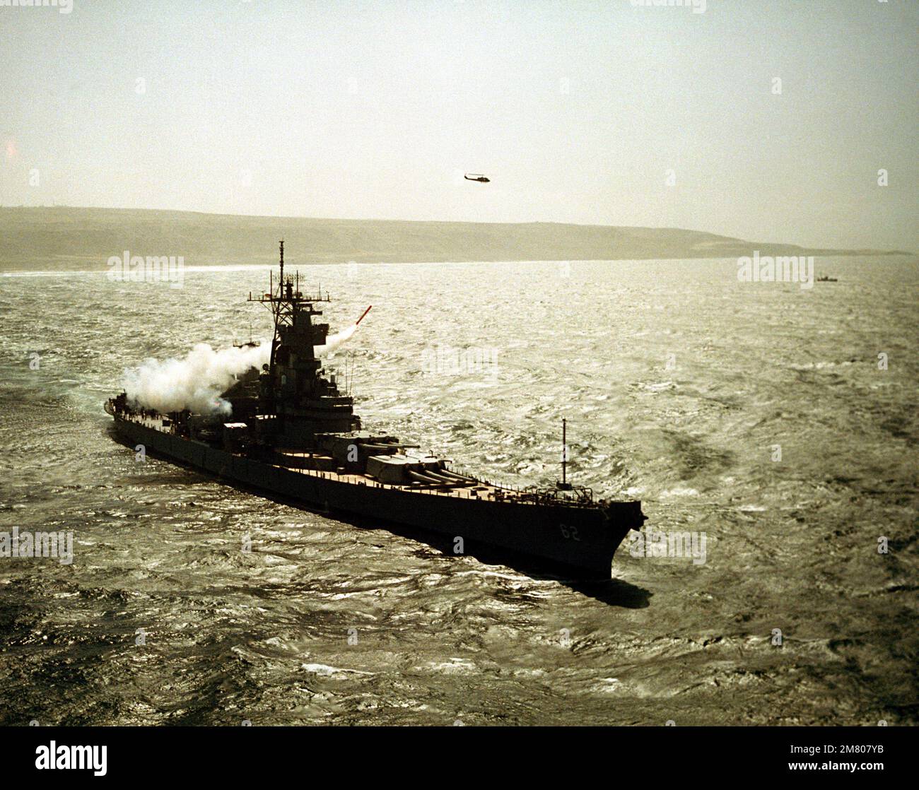 An aerial starboard bow view of the USS NEW JERSEY (BB-62), during the ...