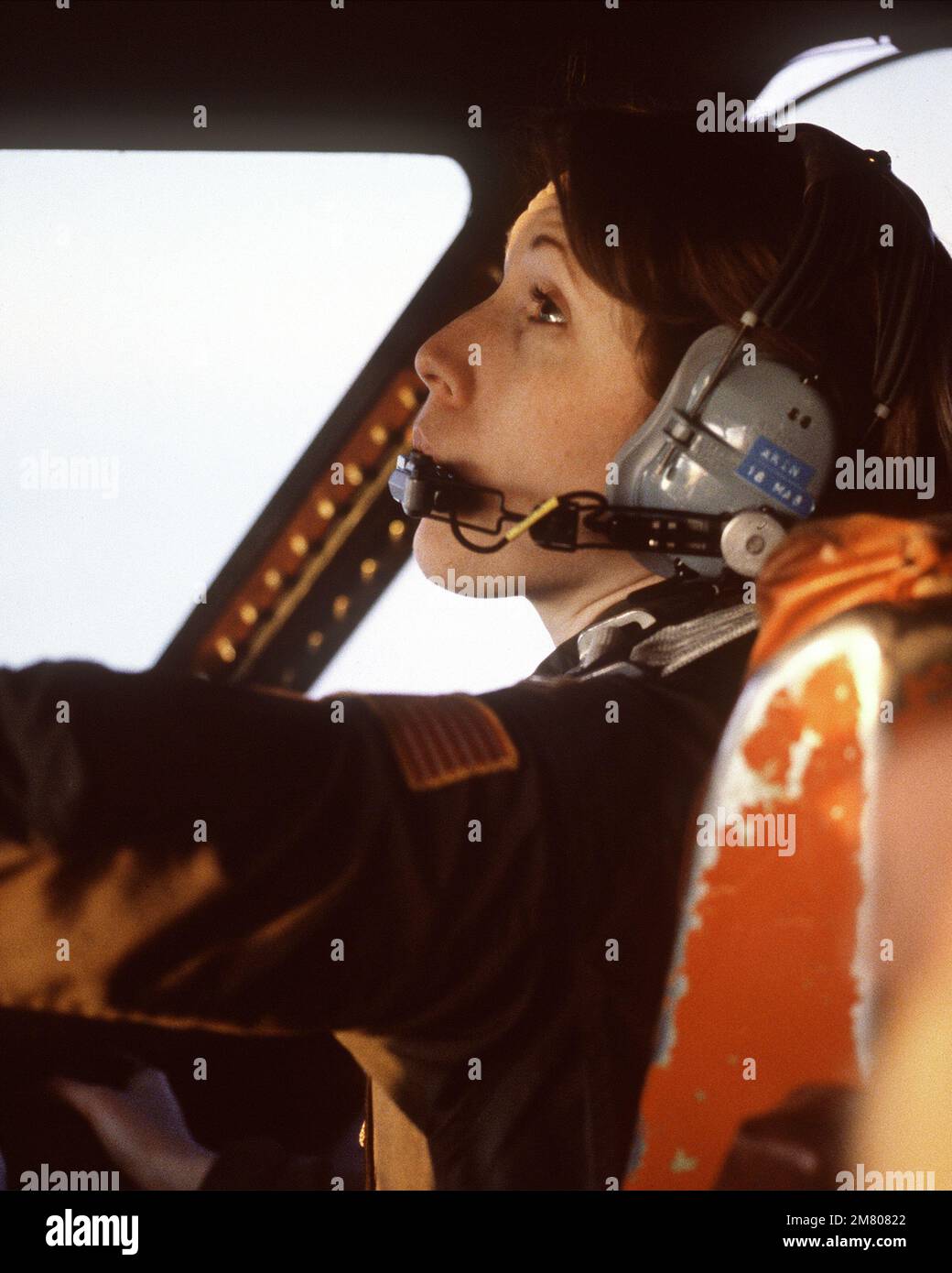 CAPT. Barbara Akins serves as co-pilot during the landing of a C-141 ...