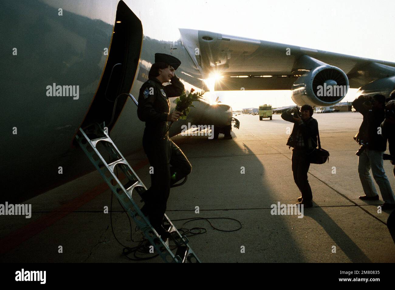 First LT. Terri Ollinger, co-pilot, deplanes from a C-141 MEDEVAC ...