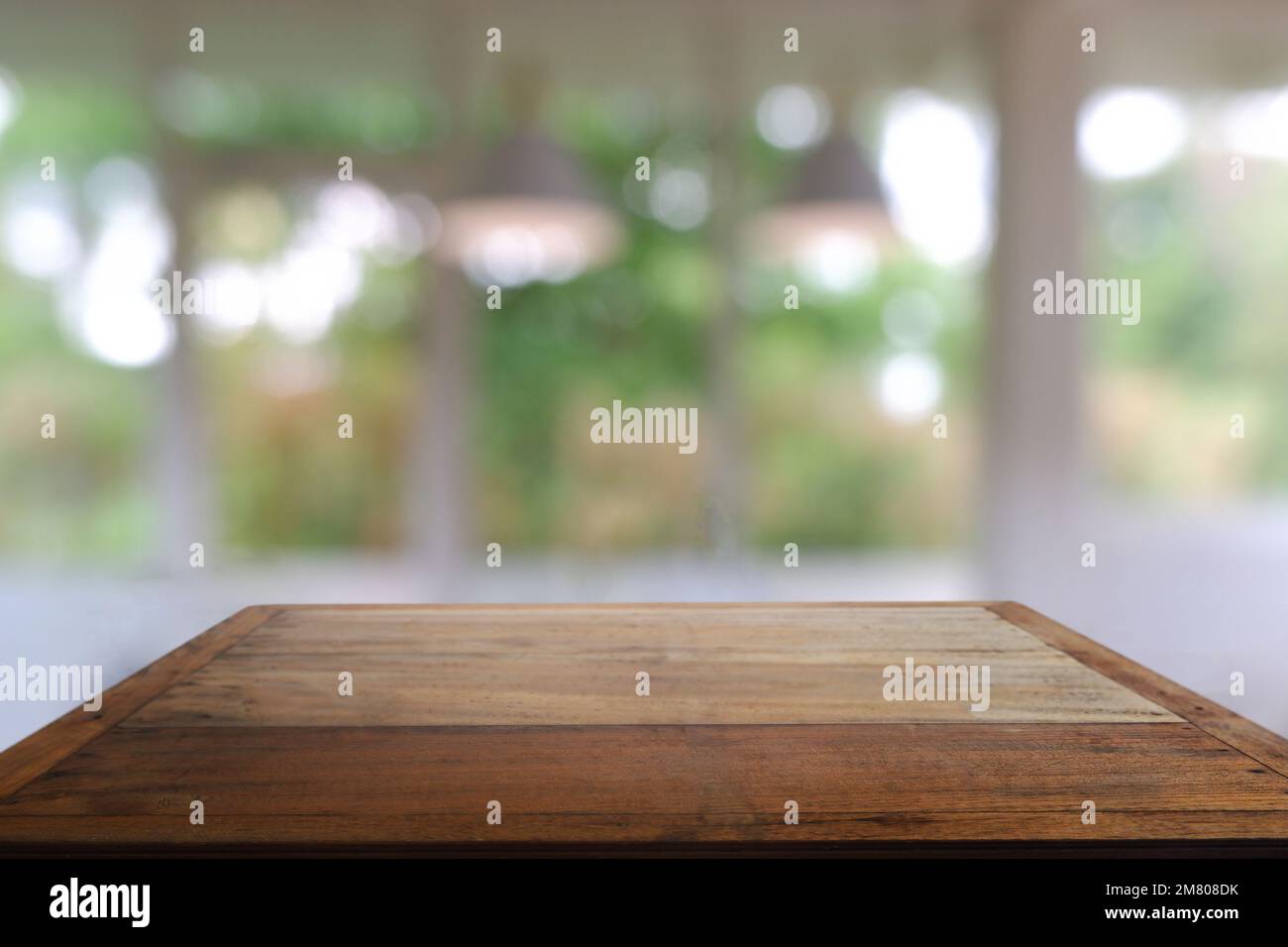 Empty wooden table in front of abstract blurred Cafe, restaurant at ...