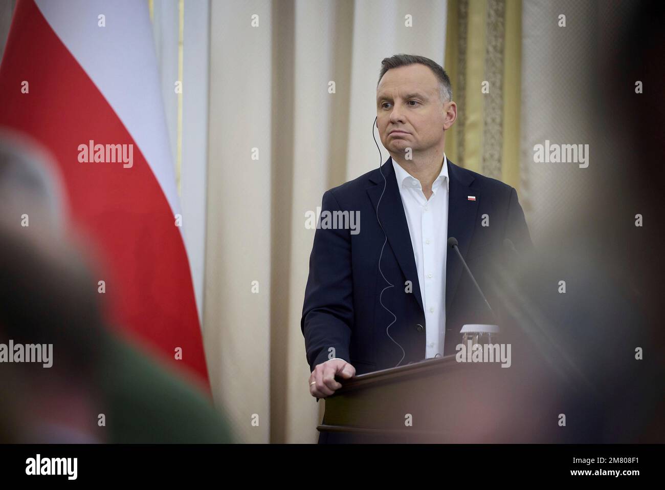 Lviv, Ukraine. 11th Jan, 2023. Polish President Andrzej Duda listens to ...