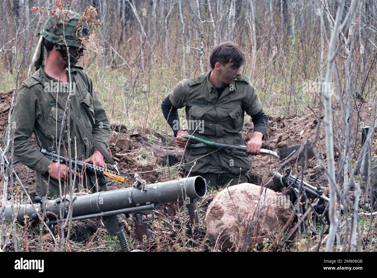 Members of the Canadian army dig a foxhole during the combined United ...