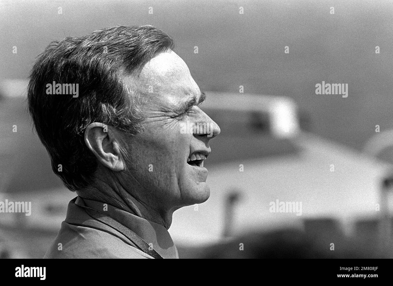 Vice President George Bush watches an airshow from the flight deck of ...