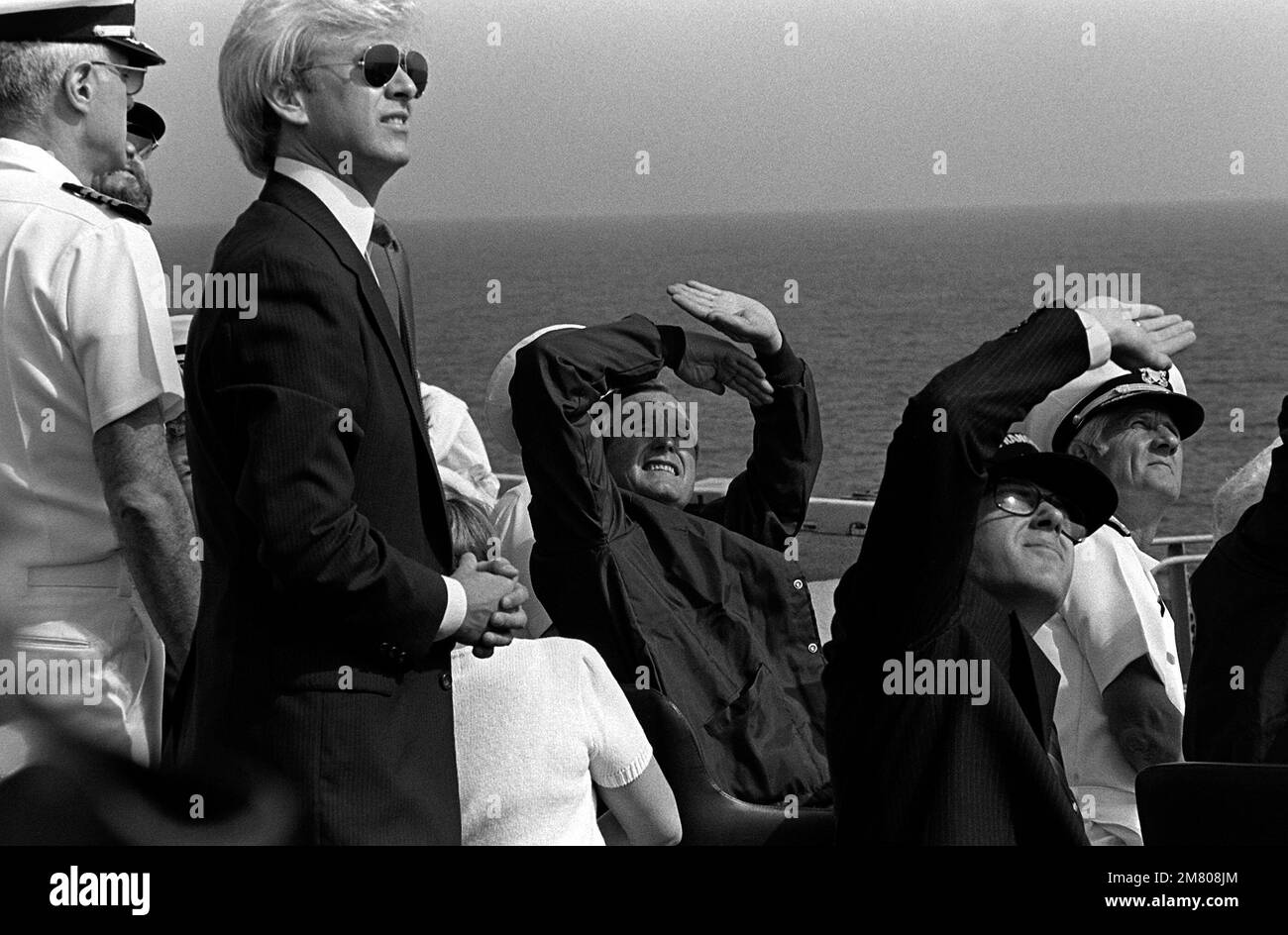 Vice President George Bush watches an airshow from the flight deck of ...