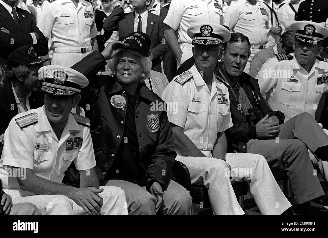 Vice President George Bush and his wife Barbara watch an airshow from ...