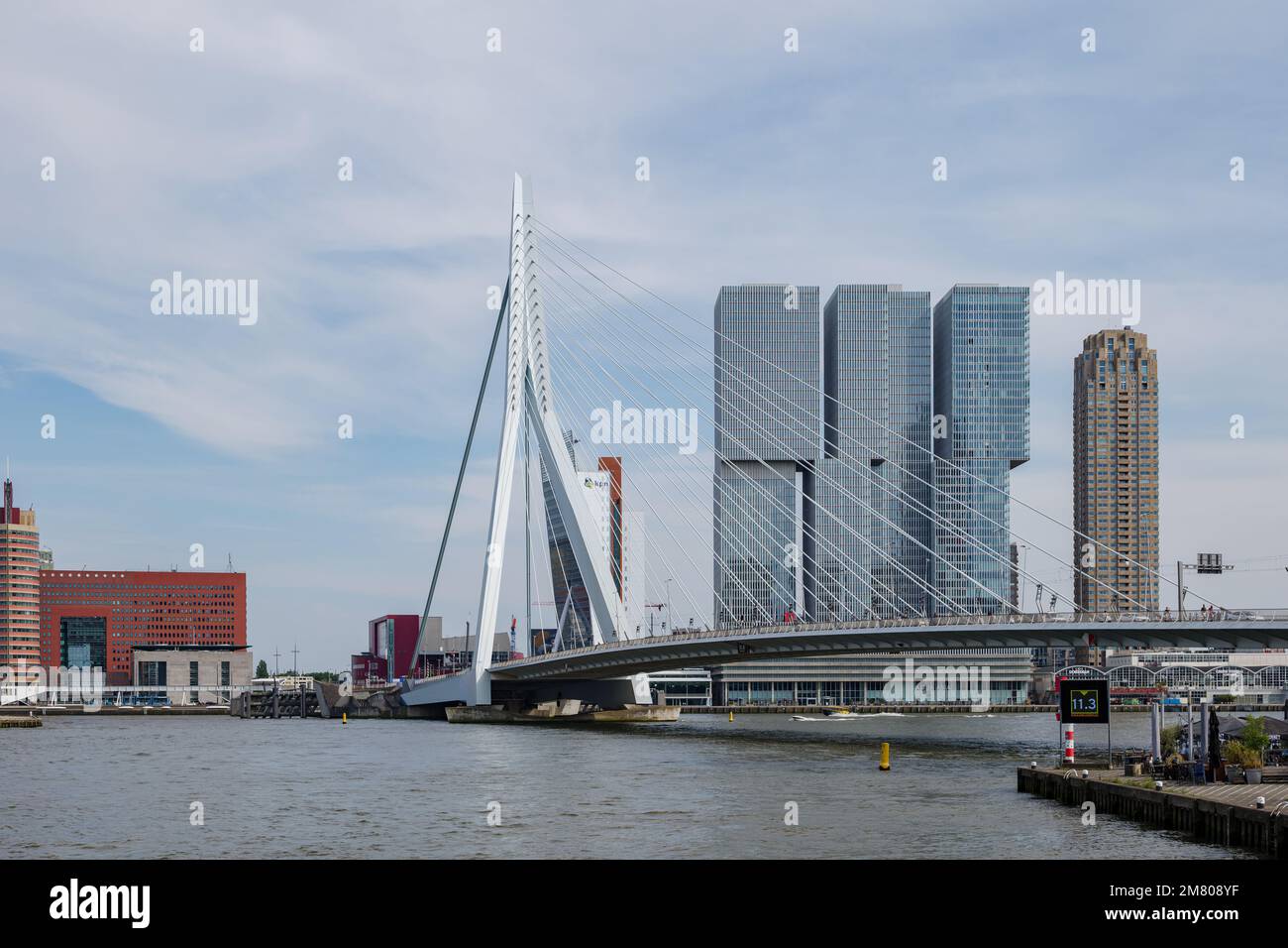 Outdoor sunny view of Erasmus Bridge, riverside of Nieuwe river and De ...