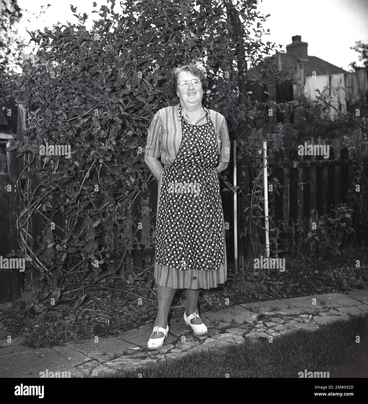 1950s, historical, mature lady wearing a spotted patterned piniofire ...