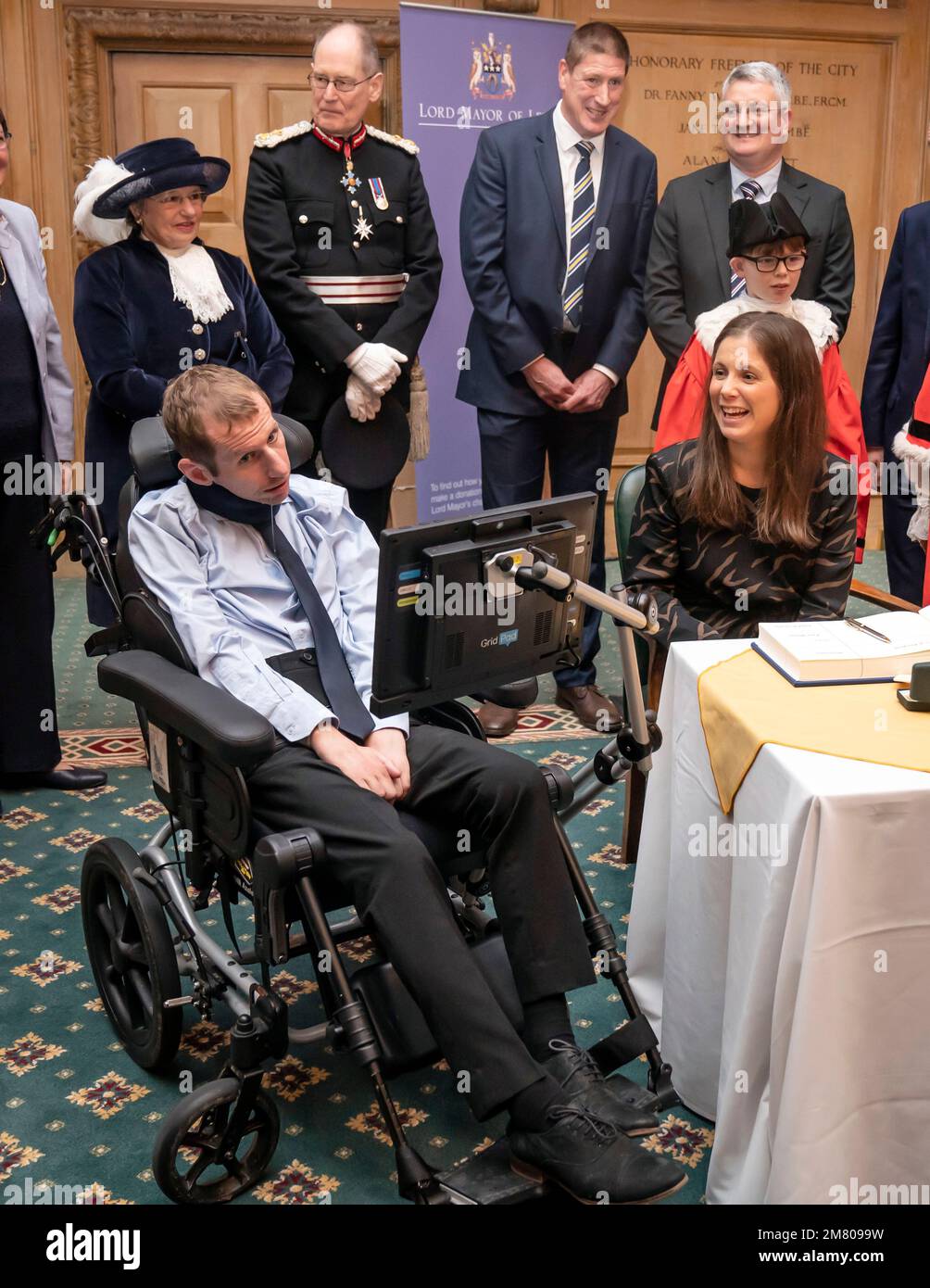Lindsey Burrow signs the Scroll of Admission on behalf of her husband ...
