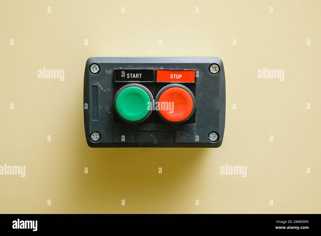 Device with start button and stop button on the wall. Close-up Stock ...