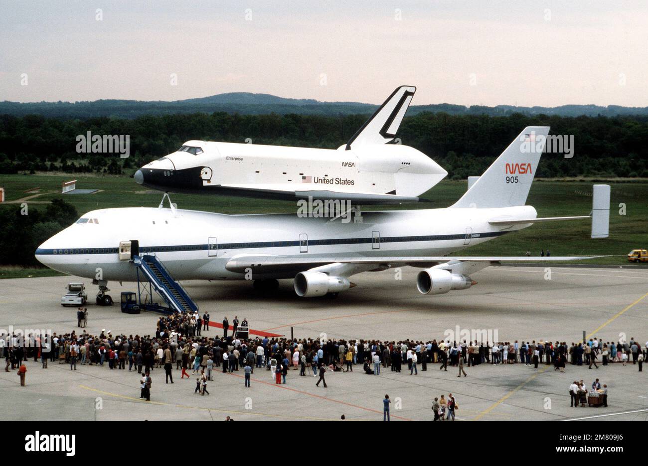 Spectators observe the arrival of the Space Shuttle Enterprise and its ...