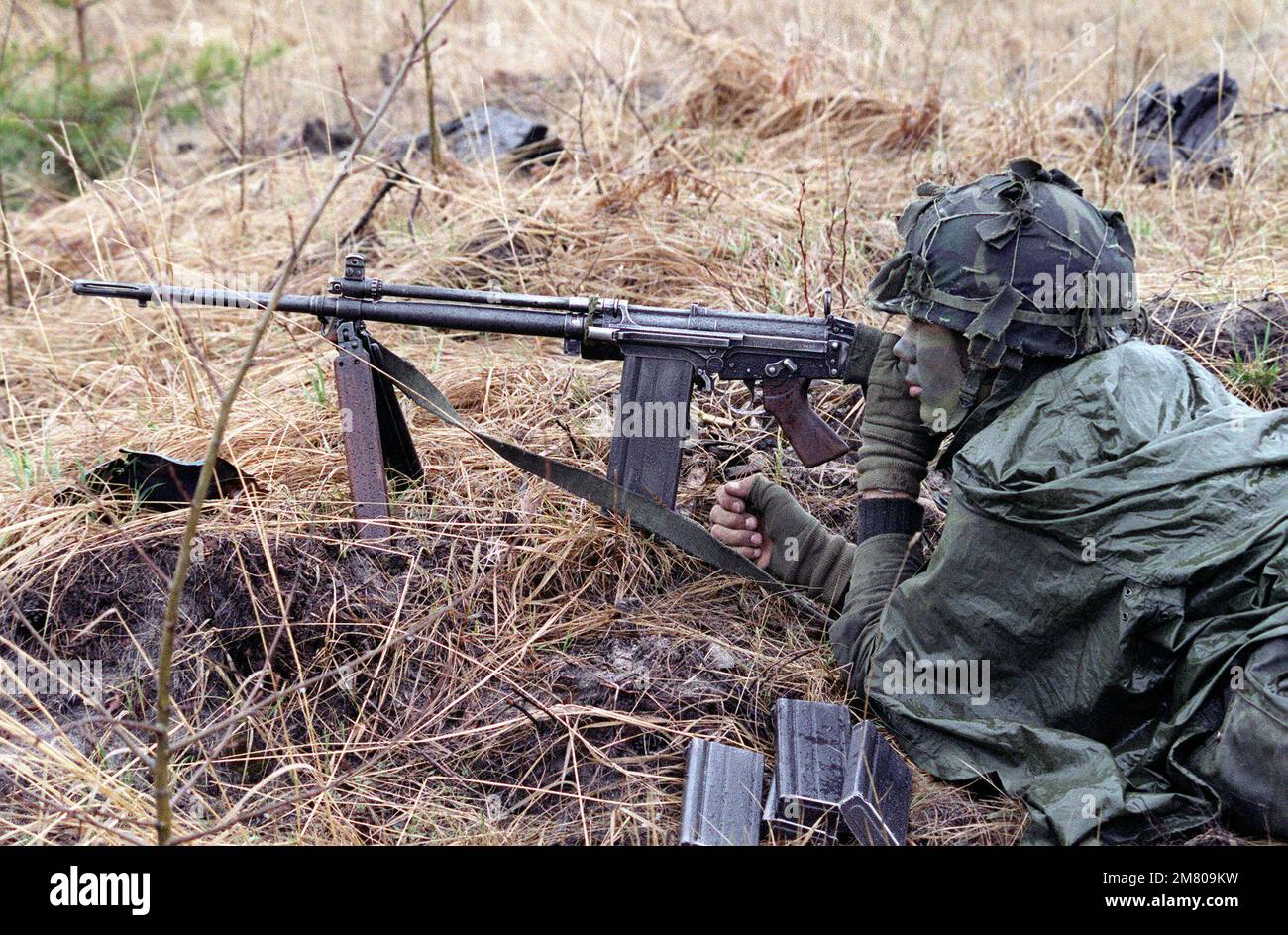 A Canadian soldier aims his 7.62mm automatic C2 heavy barreled rifle ...