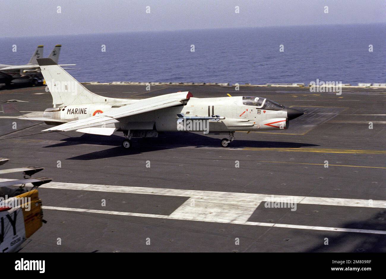 A French Marine F-8E (FN) Crusader aircraft lands aboard the nuclear ...