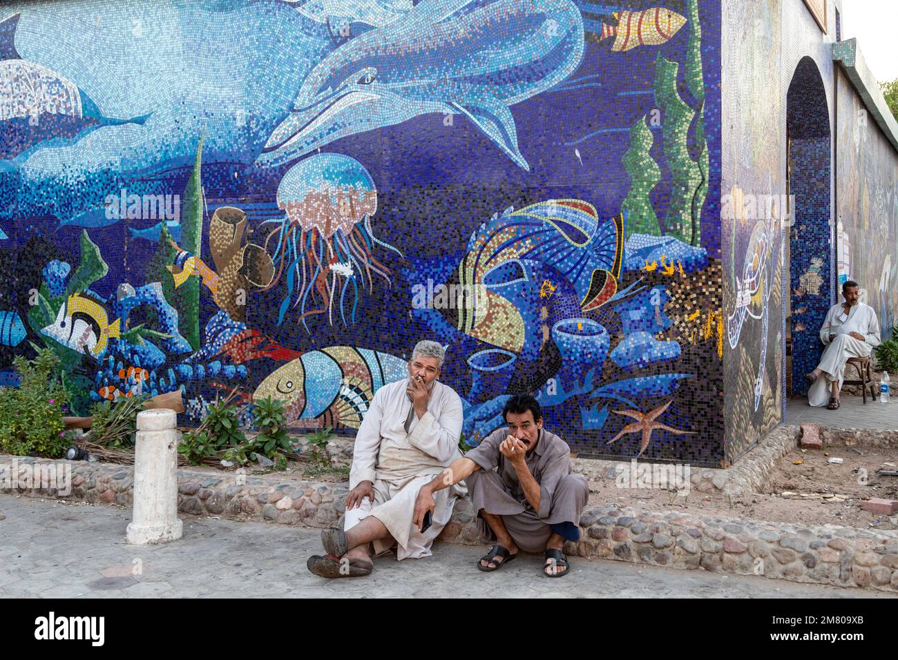 CIGARETTE BREAK IN FRONT OF THE ENTRANCE TO THE MOSAIC-COVERED SOUK, EL ...